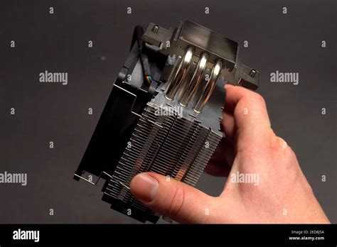 CPU Cooling System Cooler With A Radiator In The Hands Of A Man Stock Photo Alamy