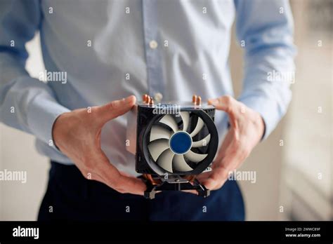 Mature Engineer Holding CPU Fan At Workshop Stock Photo Alamy