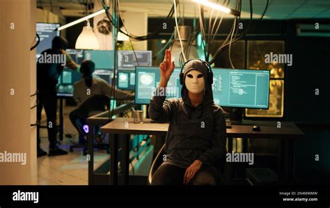 Anonymous Hacker With Mask Using Hologram To Hack Computer Server And