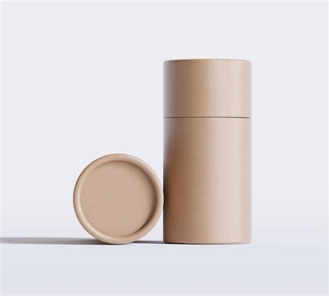 하 바탕에 고립 된 갈색 종이 튜브 패키지 모형 빈 공예 카튼 원형 현실주의 프리미엄 사진