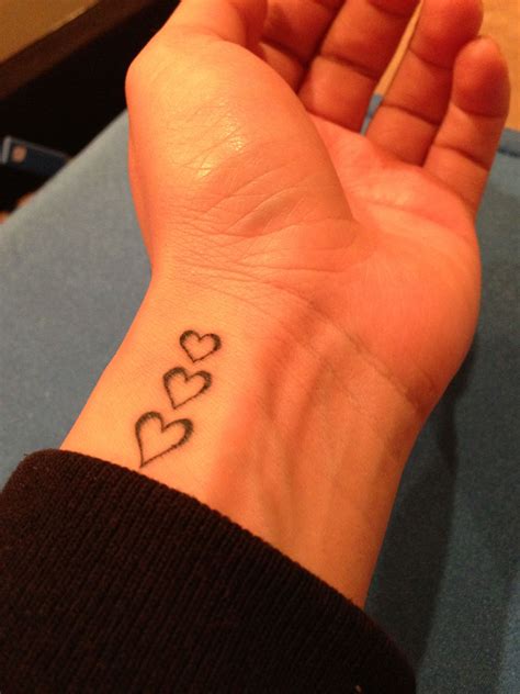 Hearts In A Row Tattoo On Wrist Heart Tattoo Wrist Heart Tattoo