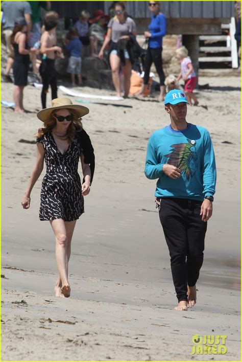 Chris Martin Goes For Malibu Beach Stroll With Heather Graham Photo