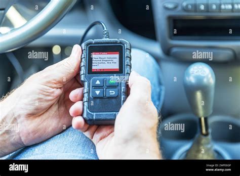 Using Diagnostic Car Code Reader To Erase Error Codes And Turn Off Check Engine Light Stock