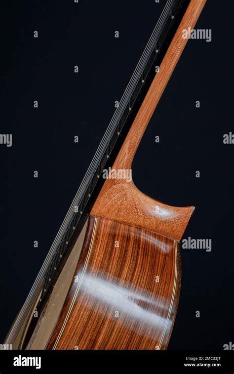 Classical Guitar Top Isolated On Black Background With A Beautiful