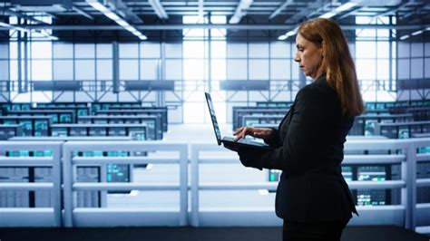 Free Photo It Specialist In Server Hub Monitoring Server Infrastructure Using Notebook