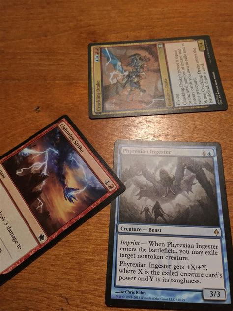 Can I Lighting Strike To Kill This Phyrexian Ingester Right As It Hits The Table Before It Picks