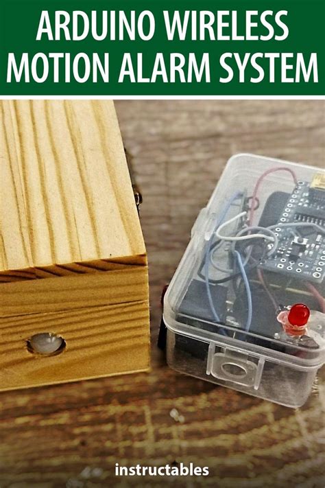 The Arduino Wireless Motion Alarm System Sits Next To A Wooden Box With Wires In It