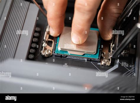 Installing A New Intel Processor By The Computer User Stock Photo Alamy