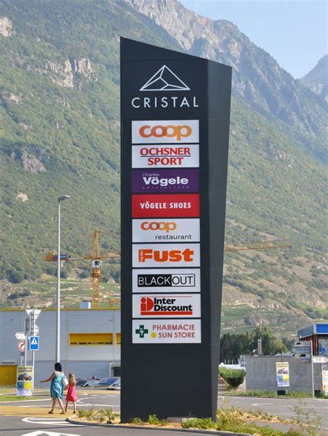 Triangular And Luminous Signage Design For Cristal Center