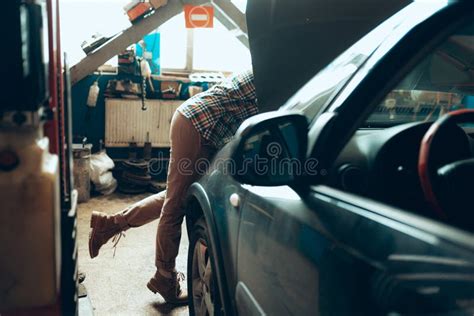 Car Reapir Exam Female Auto Mechanic Working At Auto Service Station Using Different Work