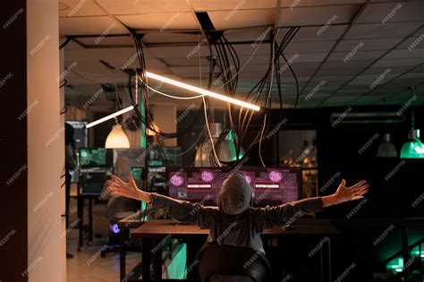 Premium Photo Hacker Celebrating Successful Computer System Password