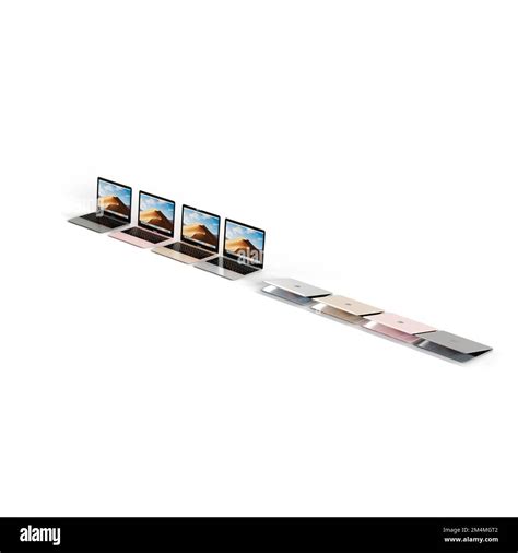 A D Render Of Different Colored Macbook Air Laptops Isolated On A White Background Stock Photo