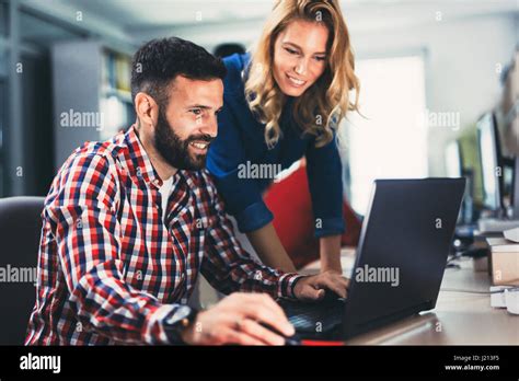 Programmer Working In A Software Developing Company Office Stock Photo