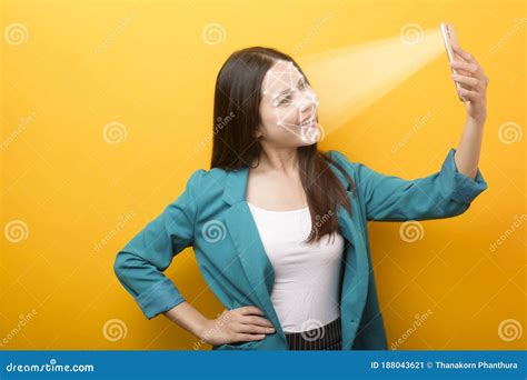Beautiful Woman Is Scanning Her Face With Facial Recognition System