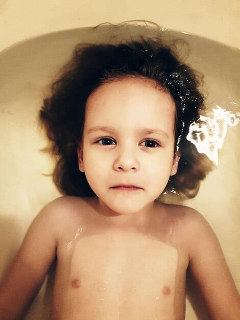 Premium Photo Portrait Of Cute Girl In Bathtub