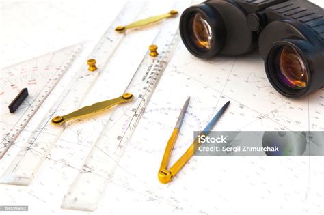 Navigation Tools Are On The Navigation Map Plotter Divider Ruler Binoculars And Pencil Stock