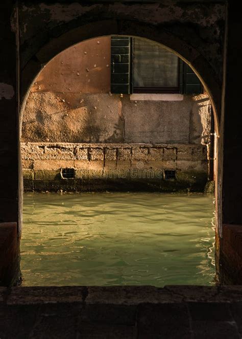 Arch Passageway Leading To A Canal In Venice Italy Stock Image