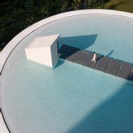 Andwich Design Tops Clifftop Library In China With Circular Pool