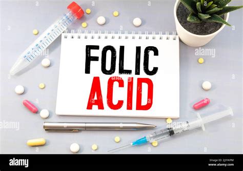 Folic Acid Medicine Concept Yellow Paper Sticker With Inscription