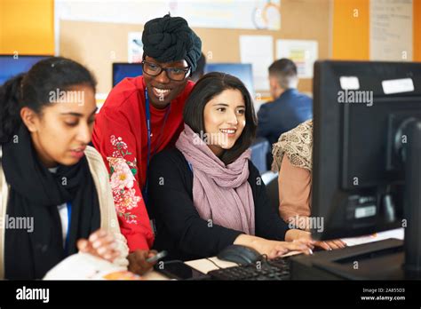 Female College Students Using Computers In Computer Lab Stock Photo Alamy