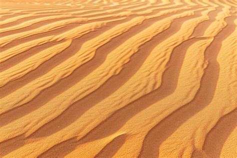 Premium Photo A Sand Dune With The Patterns Of Sand On The Beach
