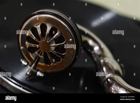 Needle Of An Old Phonograph And Black Vinyl Record Close Up Photo With