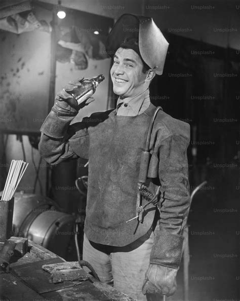 United States Circa 1950s Welder Enjoying Beer Break At Foundry Photo Indoors Image On