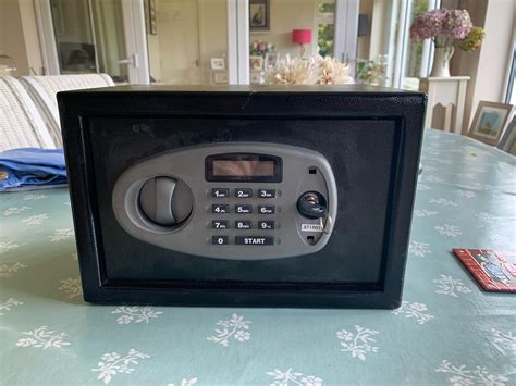 given old safe empty not sure what make model and cannot open with