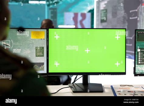 Army Recruit Operates On Surveillance Imagery And Green Screen Monitoring Battlefield Satellite
