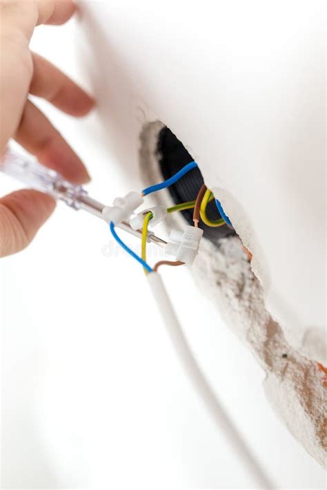 Electrician Checking The Wiring In A Wall Socket Stock Photo Image Of Installation