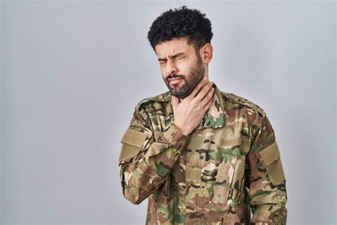 Arab Man Wearing Camouflage Army Uniform Touching Painful Neck Sore