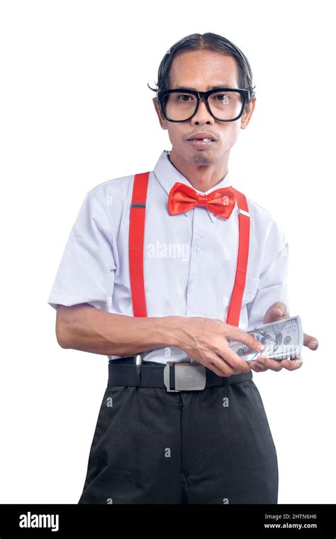 Asian Nerd With An Ugly Face Holding Money Isolated Over White Background Stock Photo Alamy