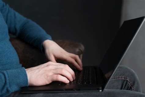 Free Photo Man Typing On The Keyboard Of His Laptop