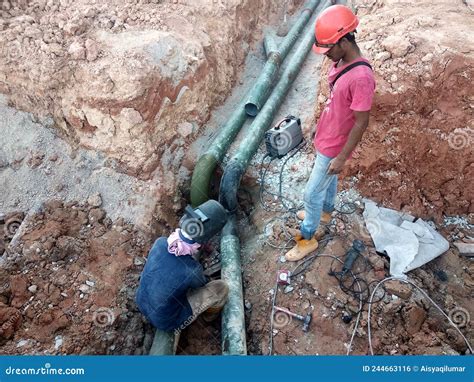 Installing Underground Downspout Drain Line Sewer Line Or Waste Pipe In A Trench Laying Pvc