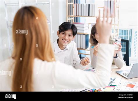 Creative Team Collaborating On Ux Ui Design Project In Modern Office