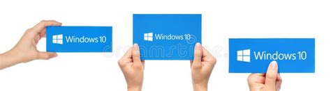 set of hands which holding windows 10 paper logotype isolated on
