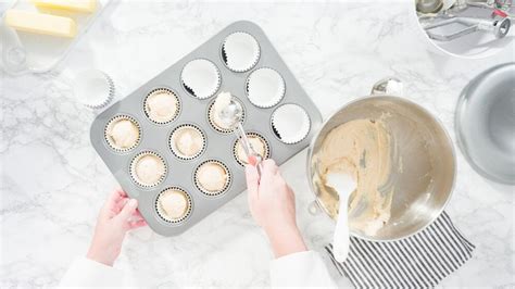 Premium Photo Flat Lay Step By Step Scooping Batter With Batter Scooper Into Cupcake Pan