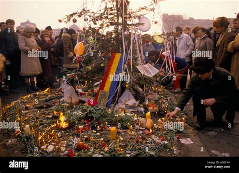 Romanian Revolution 1989 Man Lighting Candle On Roadside Shrine