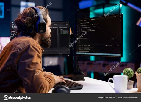 programmer listening music while fixing vulnerabilities software
