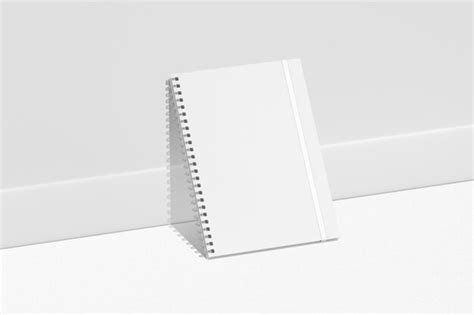 Premium Photo A White Spiral Notebook On A White Surface