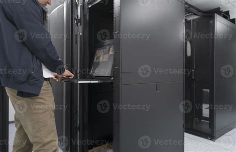 Close Up On Data Center Engineer Hands Using Keyboard On A