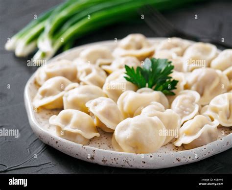 Russian pelmeni, ravioli, dumplings with meat Stock Photo - Alamy