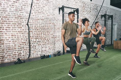 Join A Fitness Class Youll Definitely Have Fun A Fitness Group Doing High Knees While Working