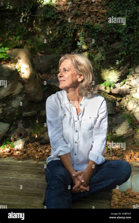 Senior Woman 61 Years Old Wearing A Shirt And Jean Autumn Season