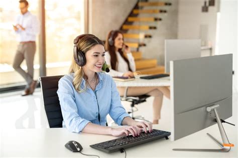 Service Desk Operator Woman With Headset Answering Clientand X27s Questions And Resolving Client