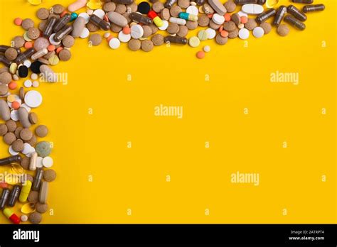 Drugs Placed In Corner Frame Made Of Round Pills And Capsules Put On One Side Medical