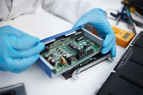 Computer Hardware Repair And Hands Of Engineer Working On Electronic Cpu Circuit And Microchip