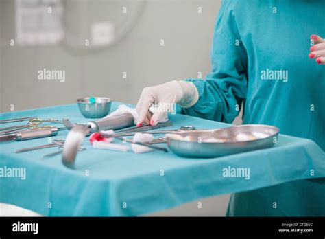 Surgeon Taking Surgical Tools On A Surgical Tray Stock Photo Alamy