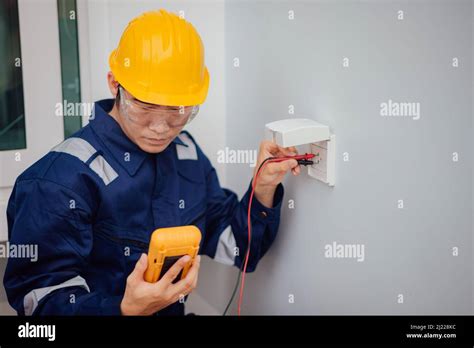 Electrician Testing For Voltage Via Multimeter Stock Photo Alamy