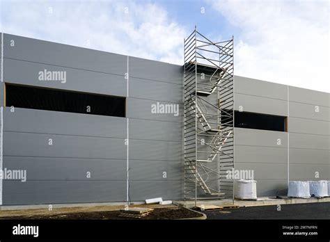Gray Sandwich Panel Facade Of A Unfinished Warehouse Building Tubular